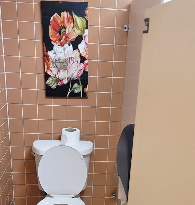 Even the bathroom shows personality with its floral art. In the hierarchy of diner necessities, clean facilities rank just below good coffee and friendly service.