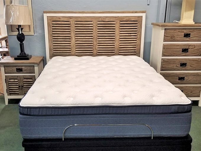 The beachy headboard and pristine mattress combo offers the promise of island dreams without the sand in uncomfortable places&mdash;Florida sleeping at its finest.
