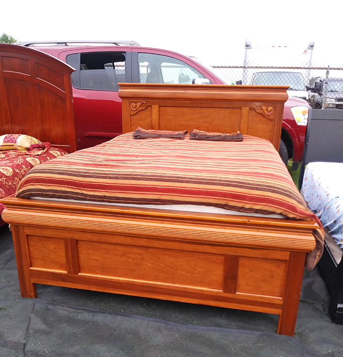 Bedroom furniture with stories to tell, priced so reasonably you'll have money left for the matching nightstands hiding three rows over.