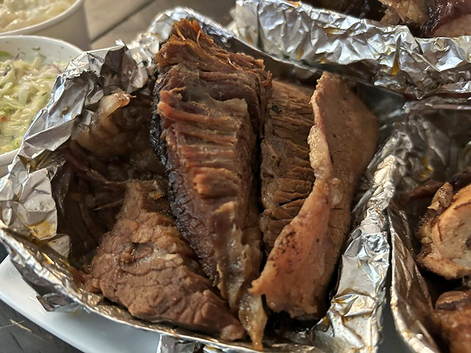 Brisket so tender it practically surrenders at the sight of your fork. The foil is just trying to contain the magnificence.