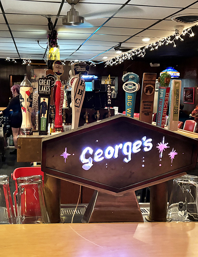The illuminated George's sign glows like a beacon for thirsty travelers. Those tap handles promise adventures in liquid form.