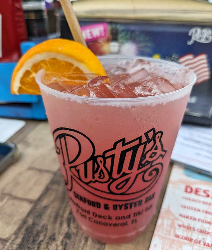 "A frosty pink concoction in Rusty's signature glass &ndash; because seafood this good deserves a vacation-worthy beverage companion."