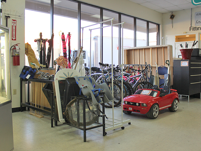 The sports equipment corner: where barely-used bicycles and that red kiddie car await new adventures. Someone's abandoned fitness resolution becomes your new hobby.