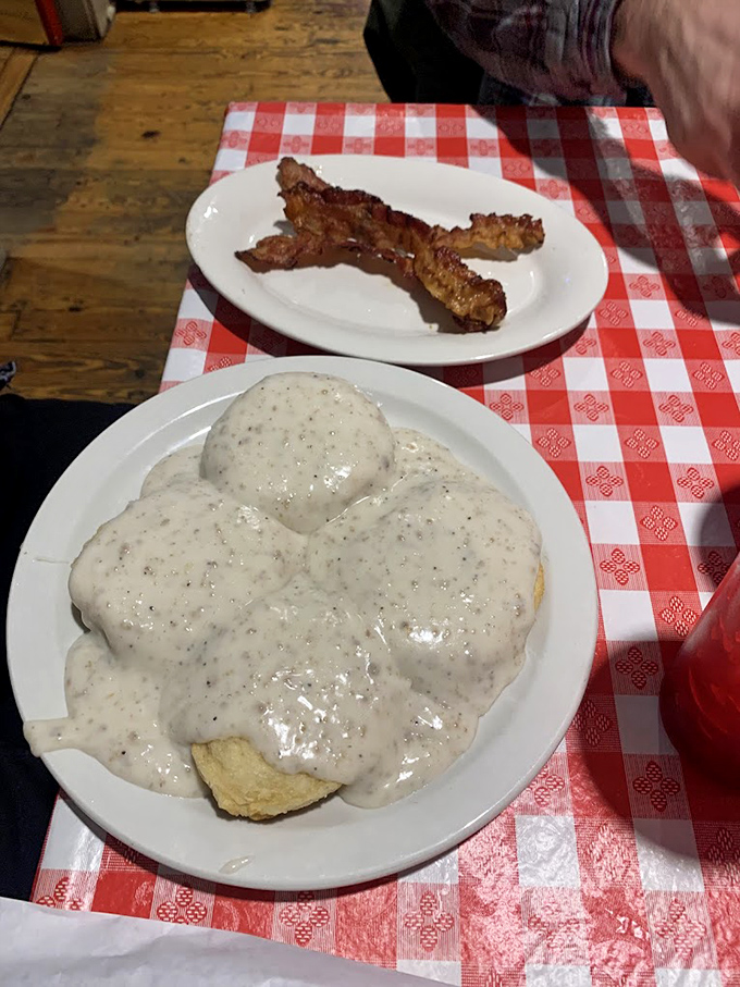 Biscuits and gravy that would make your grandmother both proud and jealous. That creamy pepper gravy blanket is the breakfast equivalent of a warm hug.