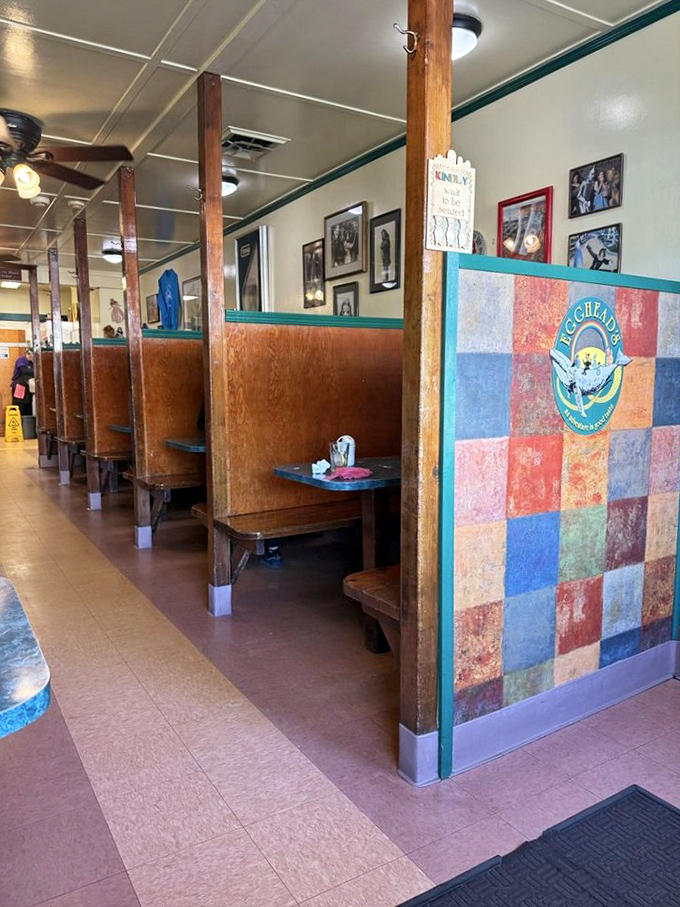 Booths that have witnessed countless conversations, celebrations, and food comas. The wooden dividers create little breakfast kingdoms for each party.