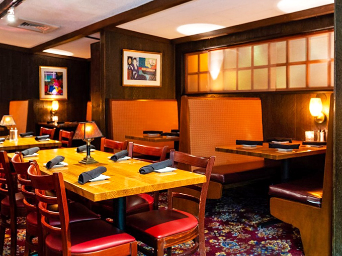 Comfortable booth seating where conversations flow as smoothly as the wine and friendships deepen over shared plates.