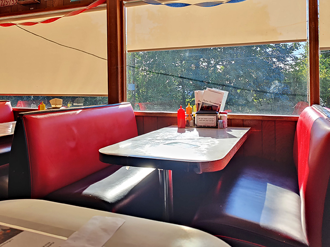 Sunlight streams through windows onto classic diner tables, creating the perfect setting for that moment before burger bliss begins.