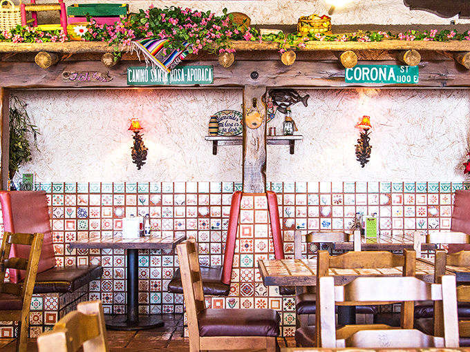 Booth seating adorned with Corona street signs and colorful tiles. The perfect backdrop for conversations that flow as easily as the salsa.