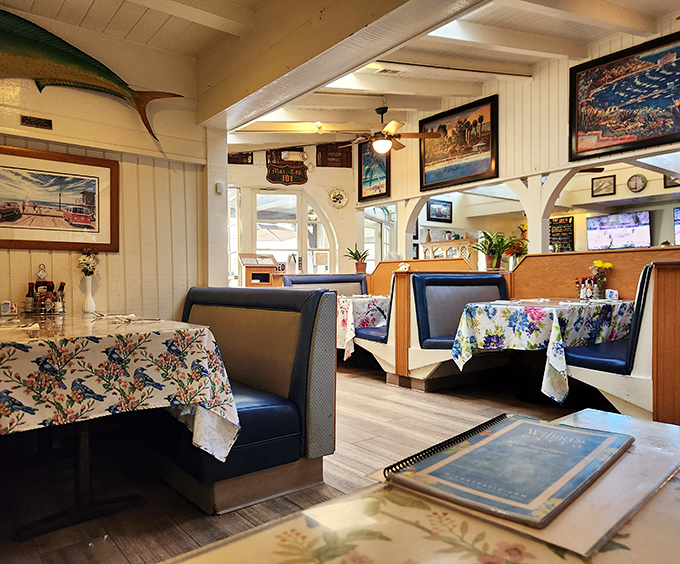 Cozy booth seats where countless first dates turned into lasting love stories over fish and chips.