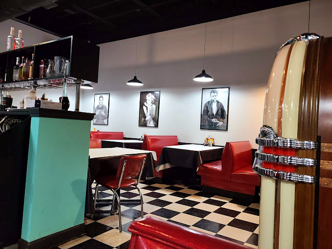 The booths aren't just seating; they're front-row tickets to the greatest show on earth: classic American dining with a soundtrack of sizzling grills.