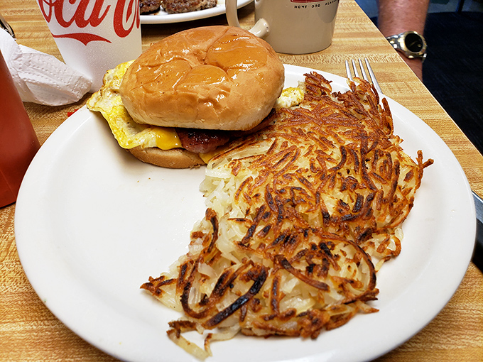 A breakfast sandwich that understands the importance of proper egg-to-meat ratio, with hashbrowns that have achieved that perfect golden crispiness.