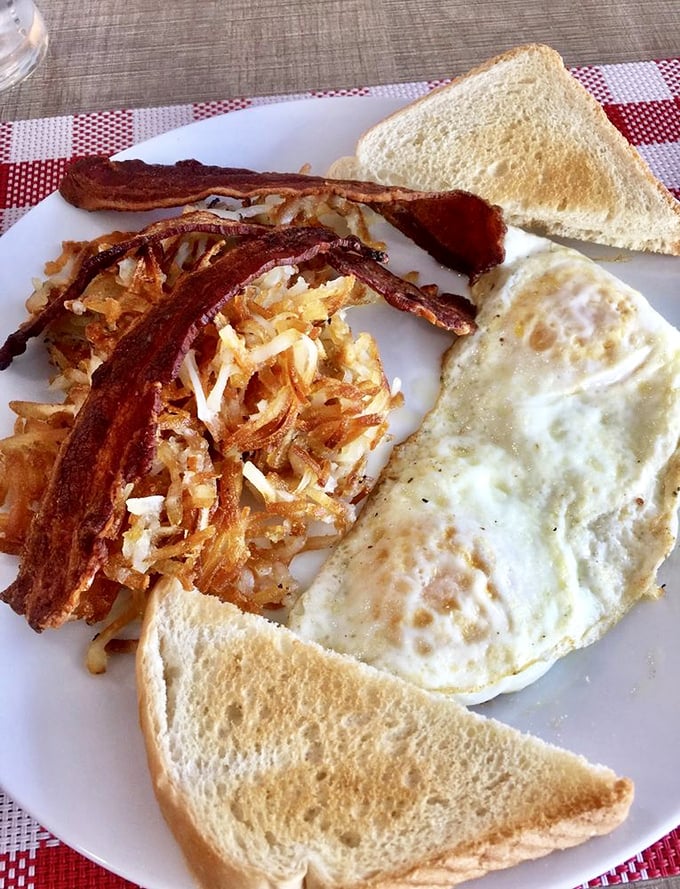 Breakfast doesn't get more classic than this: eggs, hash browns, bacon, and toast&mdash;the morning quartet performing their greatest hits on a white plate.