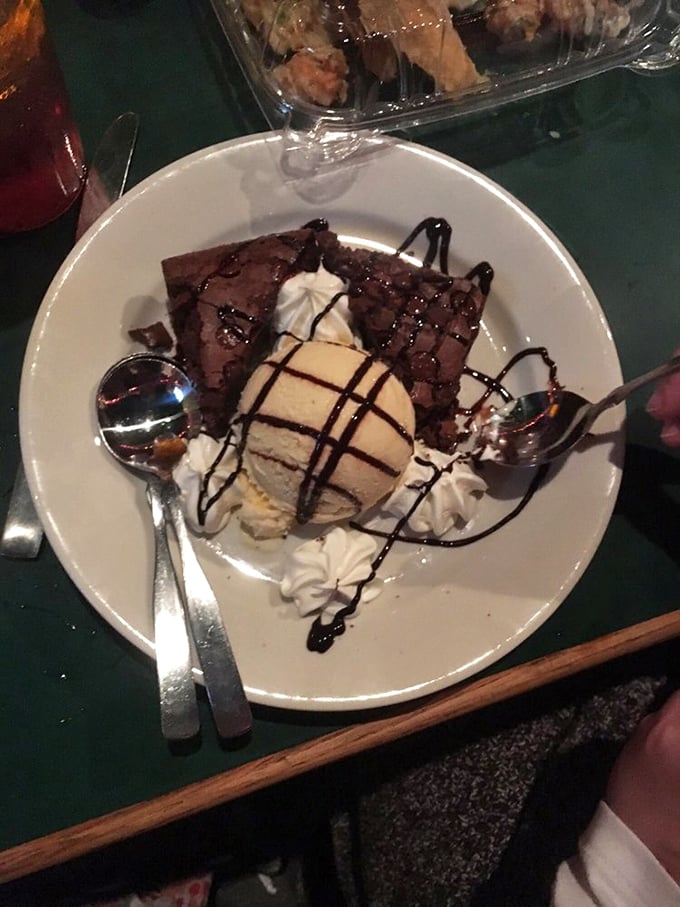 Brownie &agrave; la mode with chocolate drizzle&mdash;because after conquering the sea, you deserve a sweet victory celebration on dry land.