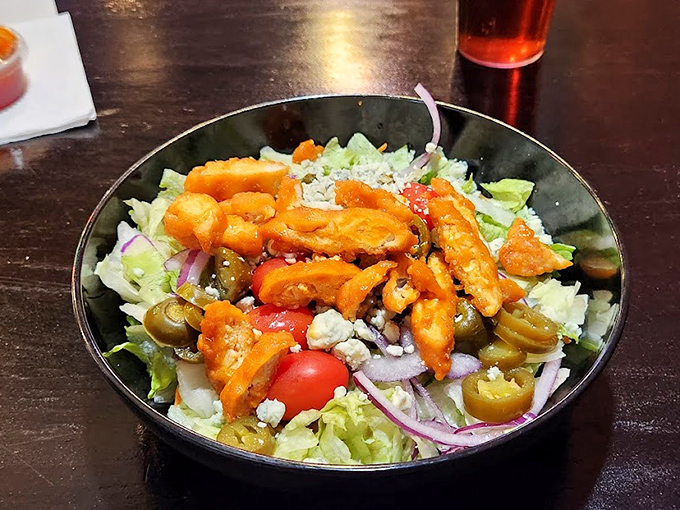 Buffalo chicken salad that breaks the rules&mdash;spicy chicken chunks command attention atop crisp greens, proving salads don't have to be boring.