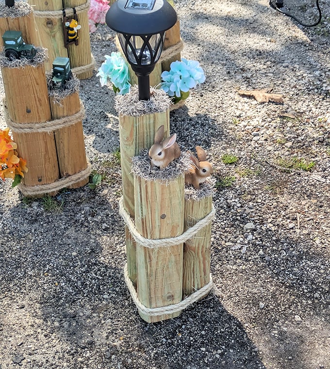 Garden whimsy comes alive with these charming wooden post creations&mdash;where solar lights and decorative bunnies transform ordinary yards into storybook settings.