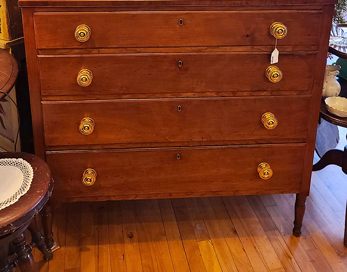 This dresser has held more secrets than a small-town bartender. Those brass pulls have been opening drawers since before your grandparents dated.