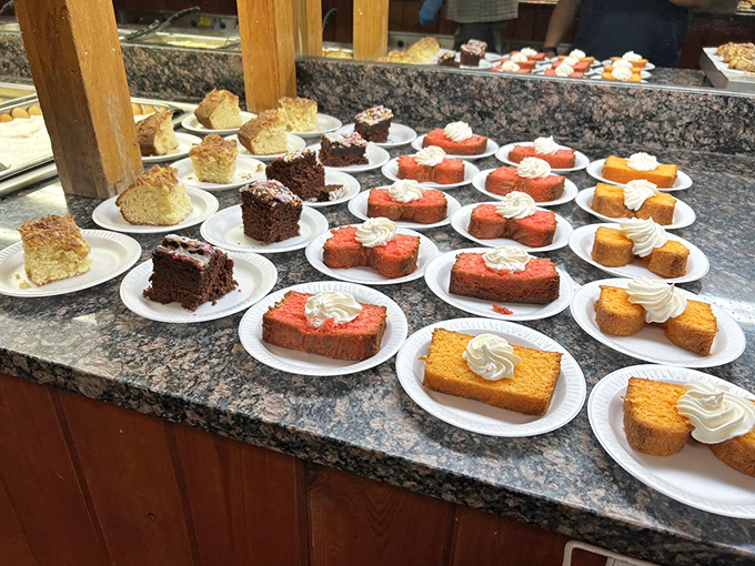 A battalion of cake slices stands at attention, their frosted tops like little chef's hats, each one silently whispering, "Yes, you deserve me."