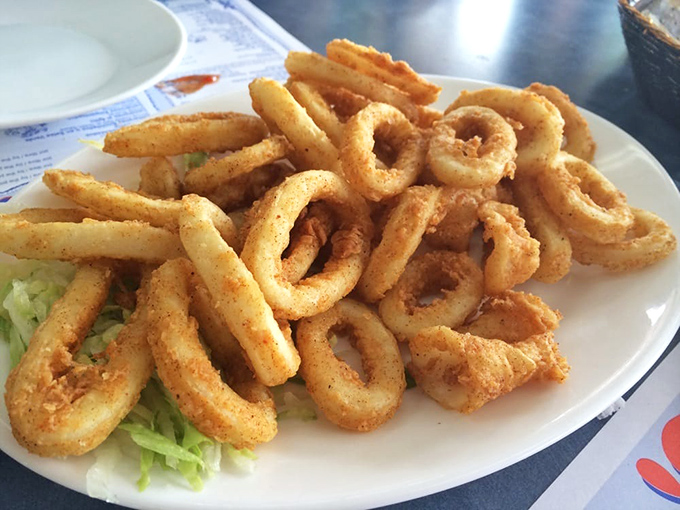 Calamari that defies the rubbery reputation of lesser versions. These golden rings are tender treasures that disappear from plates with alarming speed.