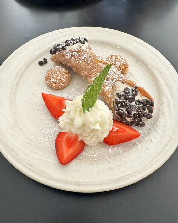 A cannoli that bridges continents &ndash; Sicily meets California in a dessert that's both delicate and decadent, with strawberries adding a fresh finale.