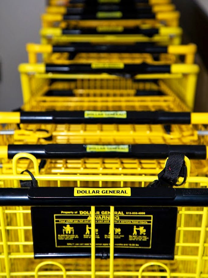 The yellow shopping carts stand at attention, eager for their next adventure through the aisles of affordable treasures.