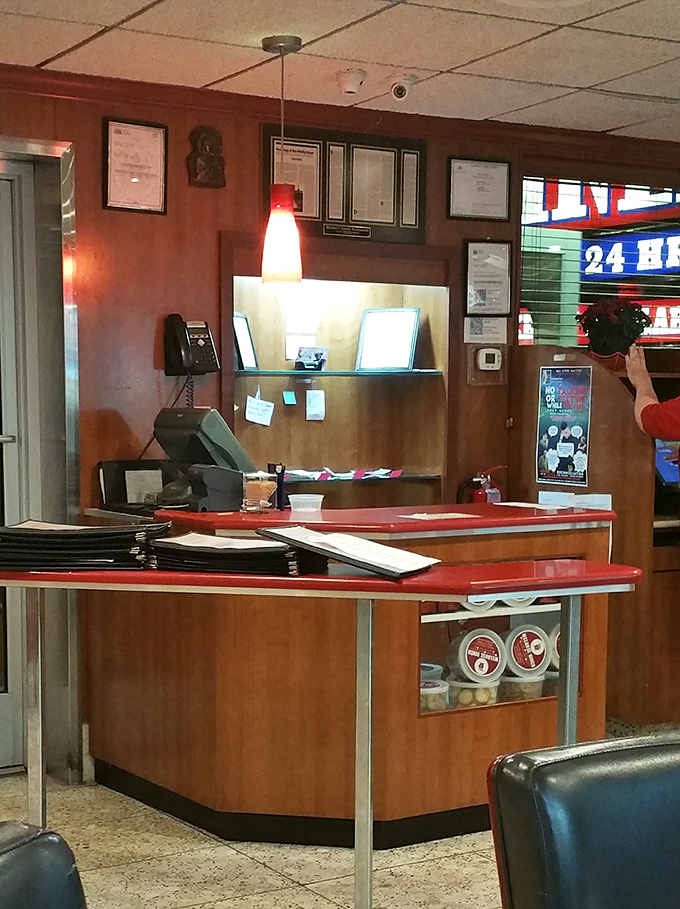 The host station, where first-timers become regulars and regulars become family. Those framed certificates on the wall? Badges of breakfast honor.