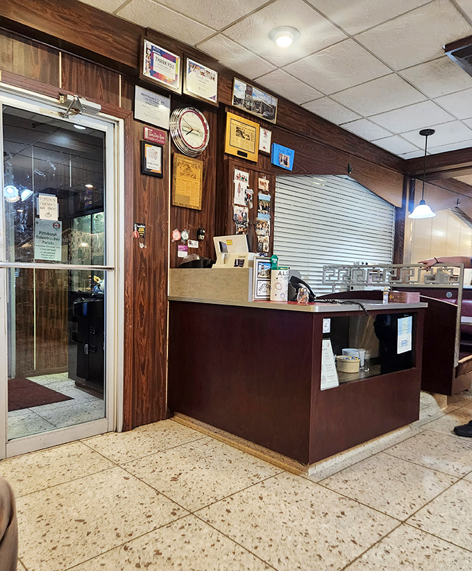The heart of operations&mdash;where orders are called and memories made. Those wood-paneled walls have absorbed decades of Pittsburgh stories.