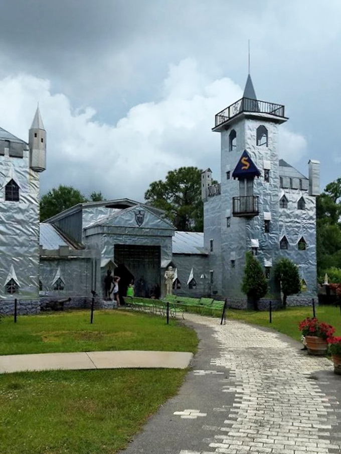 Even under moody skies, the castle maintains its magical presence, the silver exterior somehow more dramatic against the backdrop of approaching storm clouds.