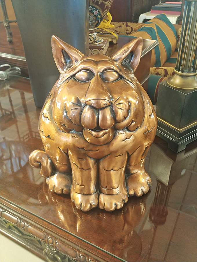This golden cat figurine isn't just decor&mdash;it's the guardian of good taste, judging your other purchases with its perpetually amused expression.