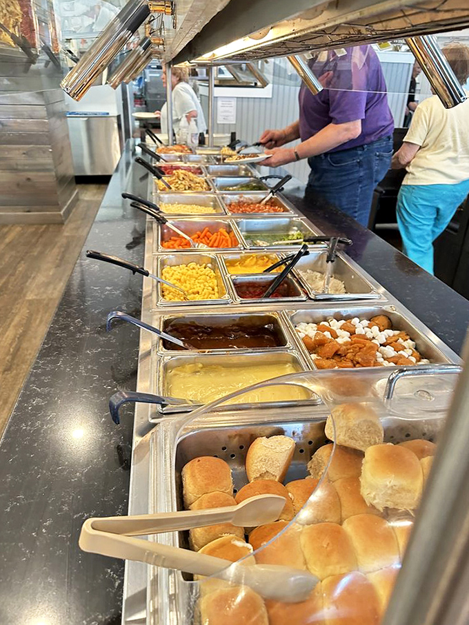 The hot food buffet stretches like a highway of homestyle delights. Each stop more tempting than the last.