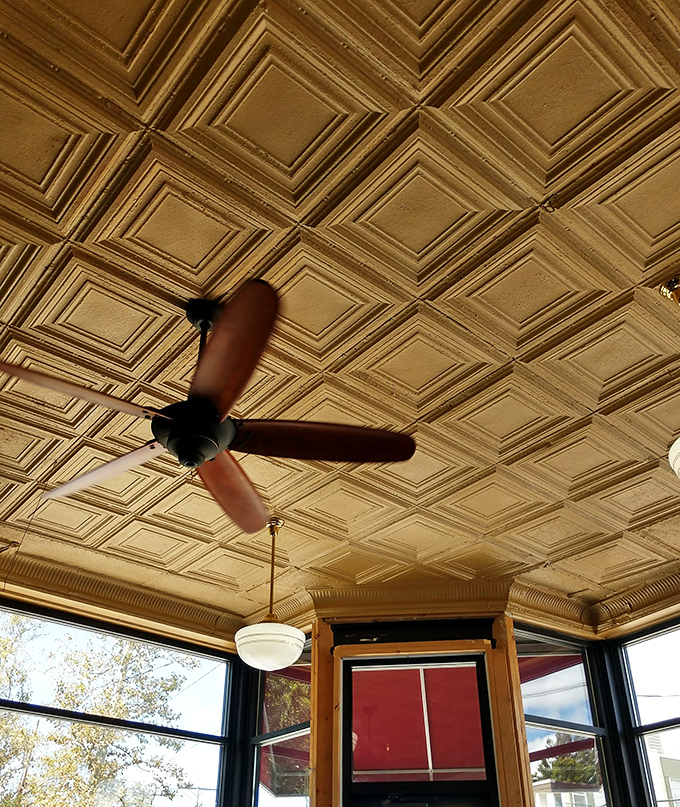 That vintage ceiling says, "We were here before Instagram, and we'll be here long after." Craftsmanship from an era when details mattered.