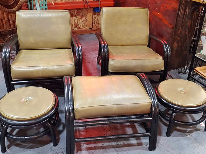 The conversation pit starter kit: vintage leather club chairs and matching ottomans that have seen decades of stories.