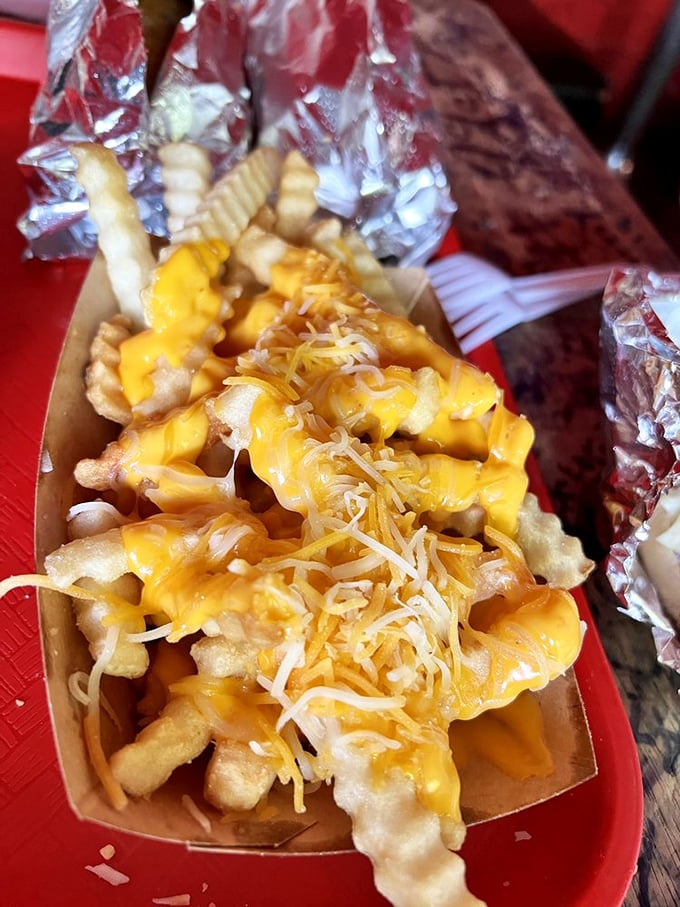 Cheese fries that don't skimp on either ingredient. When yellow meets potato, magic happens on a red tray.