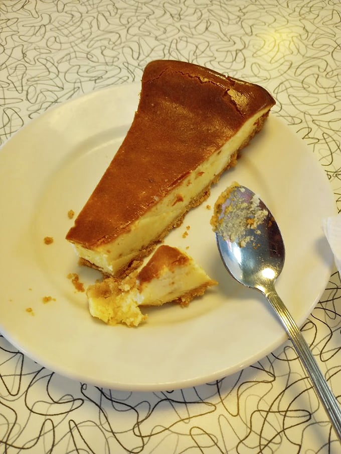 Cheesecake so smooth it could talk its way out of a speeding ticket, with a graham cracker crust foundation solid enough to build dreams on.