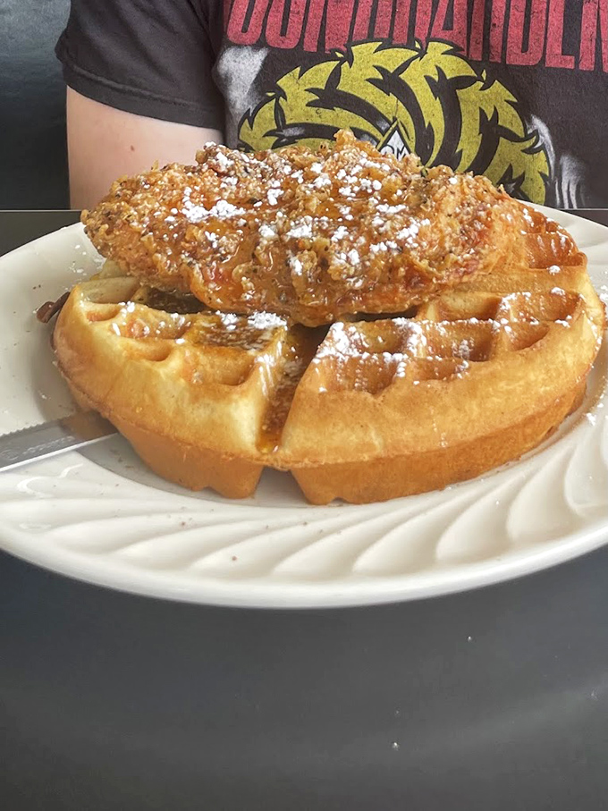 Chicken and waffles: the breakfast-lunch hybrid that proves some of the best relationships are unexpected ones. That powdered sugar sprinkle is the chef's kiss.