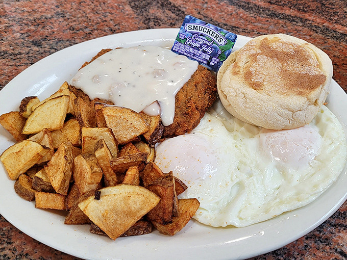 Chicken fried steak smothered in country gravy alongside sunny-side-up eggs&mdash;a plate that says "you won't need dinner" in the most delicious way.