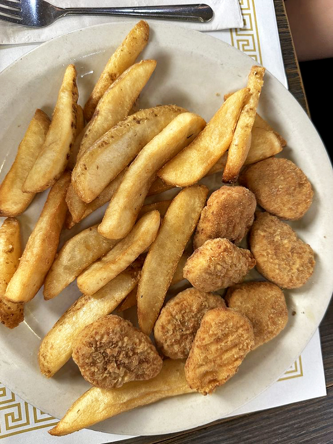 Golden-fried potatoes and nuggets—proof that sometimes the simplest side dishes are the ones we remember long after the meal is over.