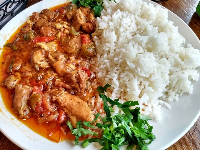 This chicken stew with rice isn't just a meal, it's a warm hug on a plate, complete with vibrant herbs for that perfect finish.