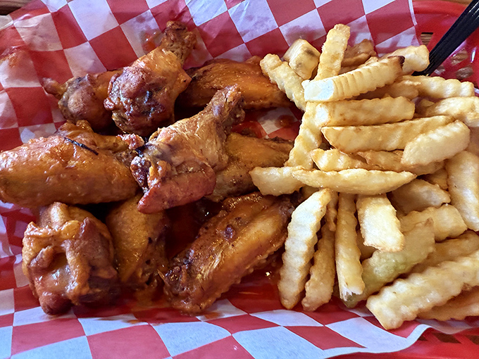 Wings that have clearly been introduced to fire and spice and decided to start a beautiful relationship. The fries are just happy to be included.