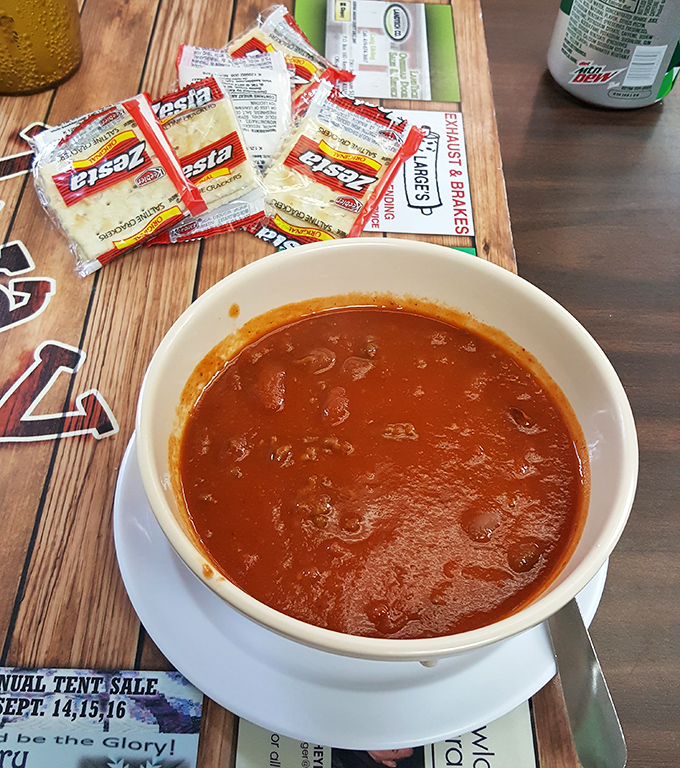 A bowl of chili that doesn't need fancy garnishes—just crackers, cheese packets, and the understanding that some recipes are perfect as is.