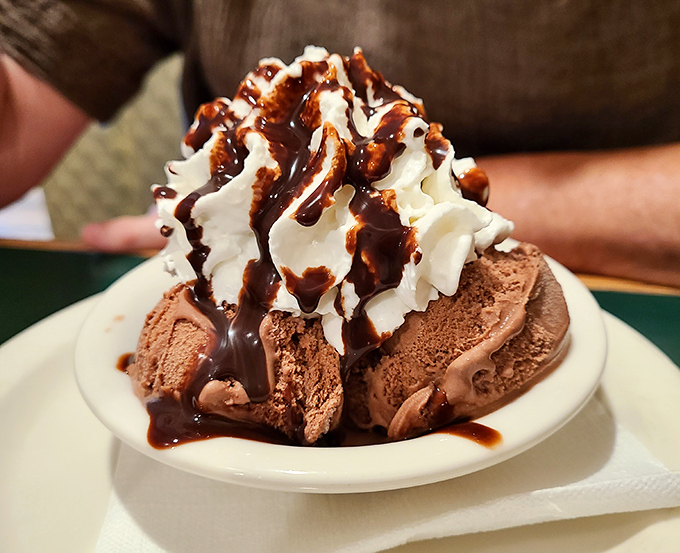 Ice cream elevated to art form&mdash;chocolate scoops crowned with whipped cream and hot fudge in a dessert that demands to be savored slowly.