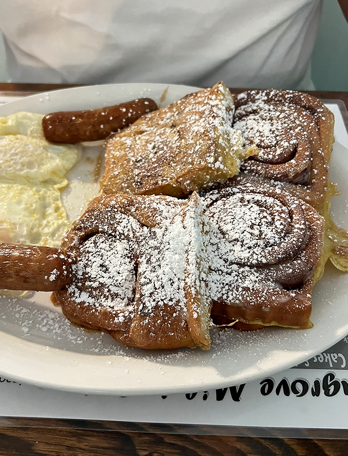 French toast that looks like it graduated from pastry school with honors and a minor in powdered sugar artistry.