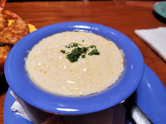 The clam chowder arrives like a creamy cloud in a blue bowl. This velvety concoction makes New England versions nervously look over their shoulders.