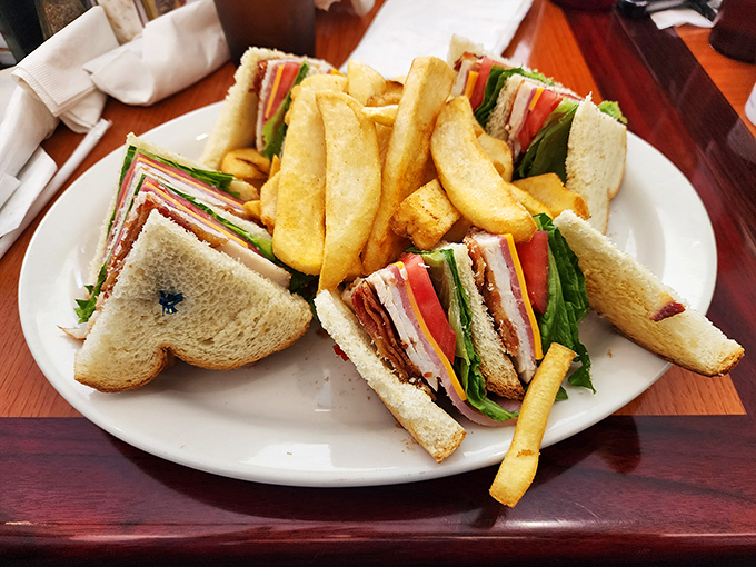 This club sandwich stands tall and proud, layers stacked with military precision&mdash;a skyscraper of flavor that requires both hands and a strategy.