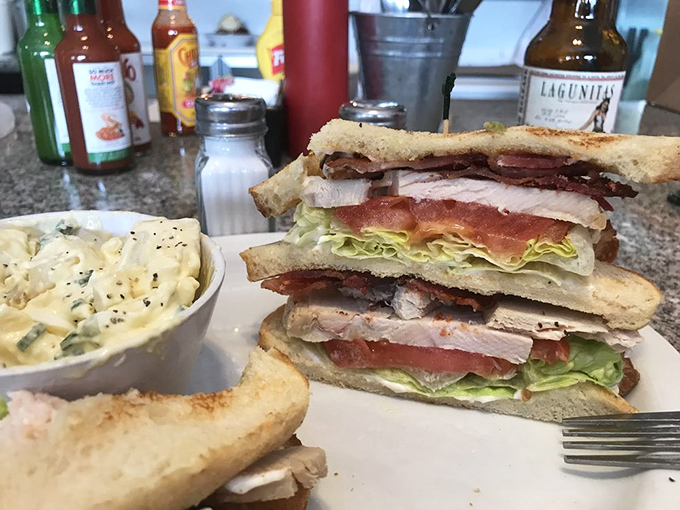 This isn't just a club sandwich&mdash;it's architectural genius with layers of flavor that puts most downtown high-rises to shame.