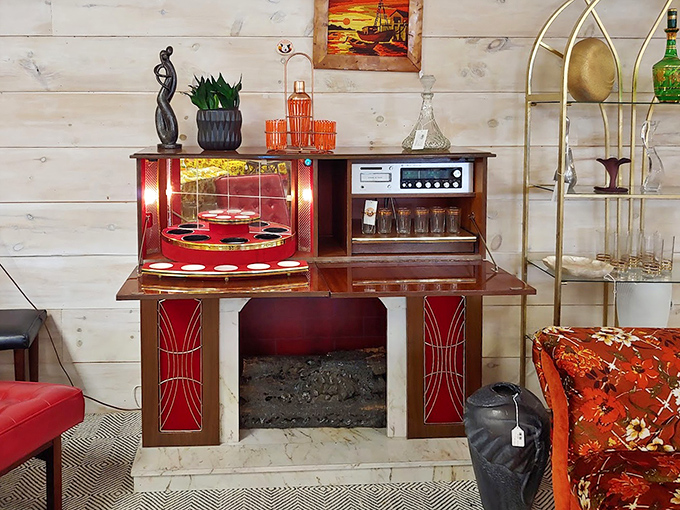 This vintage bar setup screams "sophisticated adult" in the best way possible. James Bond would approve of those red accents.