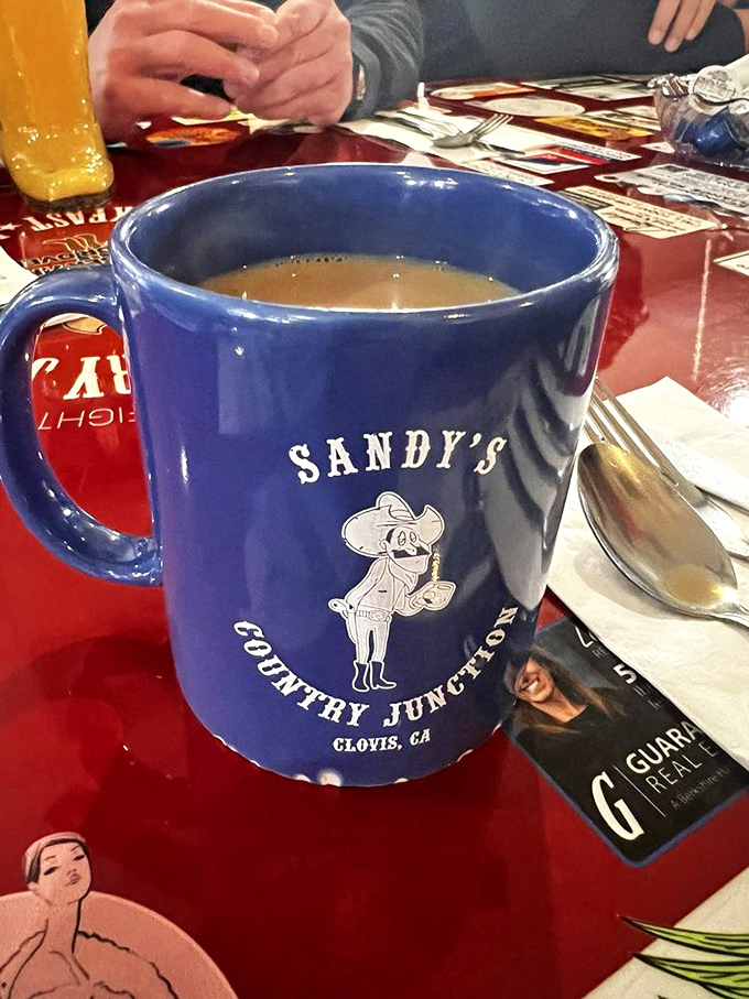 That iconic blue mug isn't just holding coffee—it's cradling liquid motivation with a side of Western charm and unlimited refill potential.