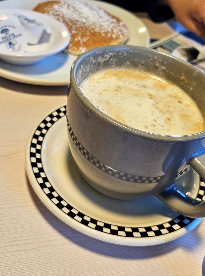 Coffee in a proper diner mug &ndash; the kind that feels like it's been warming hands and starting conversations since the Eisenhower administration.
