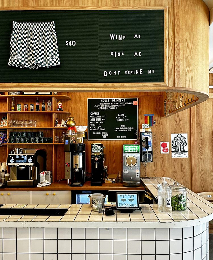 "Wine me, dine me, don't define me"&mdash;the coffee bar's cheeky signage perfectly captures the establishment's playful, irreverent spirit.