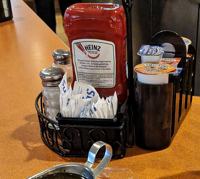 The condiment caddy&mdash;civilization's greatest achievement. Salt, pepper, ketchup, and sugar packets: the four food groups of diner dining.