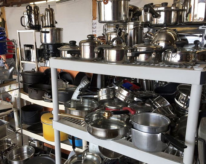 Pots and pans stacked like a chef's dream. Someone's about to score a serious kitchen upgrade without the serious price tag.